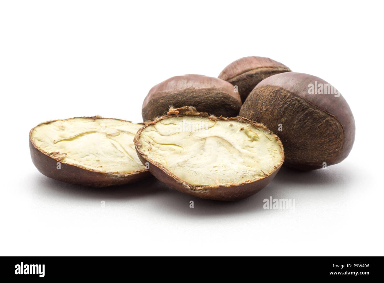 Three European chestnuts and two halves Spanish edible isolated on ...