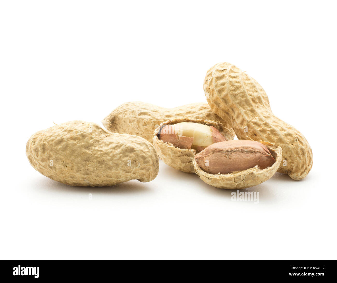 Three peanuts in husk one broken isolated on white background Stock ...