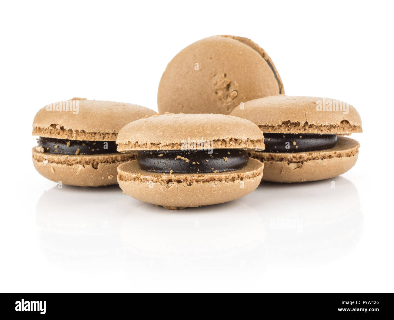 Chocolate French macarons stack isolated on white background four Stock ...