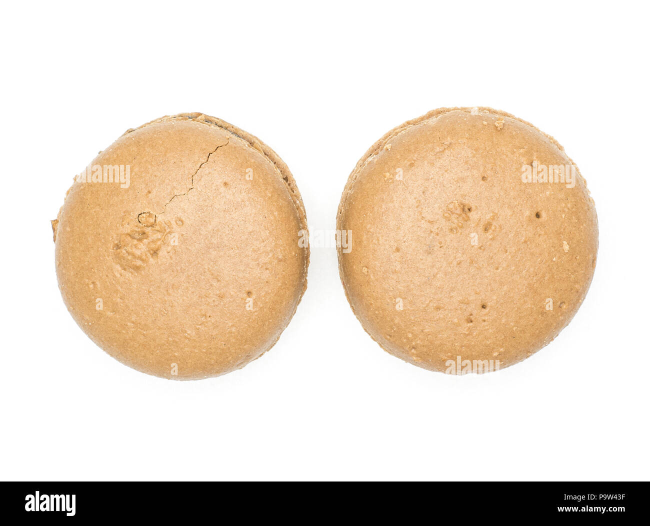 Two chocolate French macarons top view isolated on white background ...