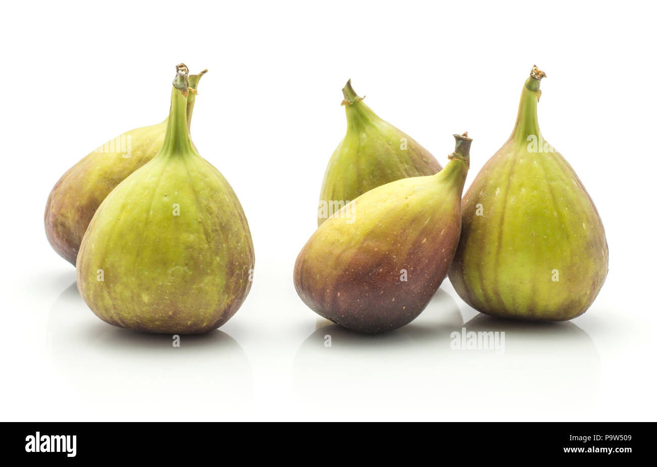 Five figs isolated on white background fresh ripe purple green Stock ...