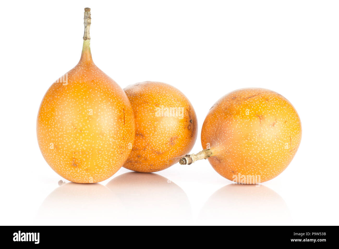 Three giant grenadilla isolated on white background sweet fresh yellow ...