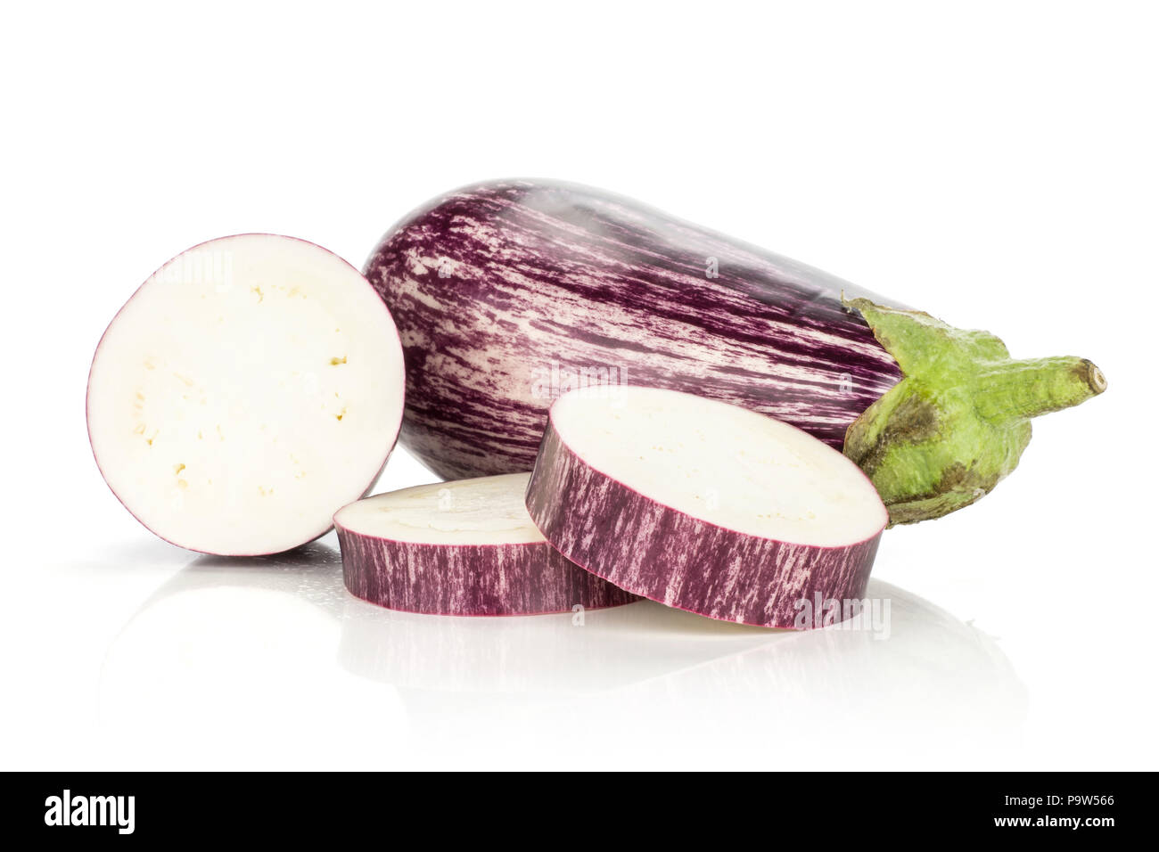 One striped purple eggplant and three sliced rings isolated on white ...