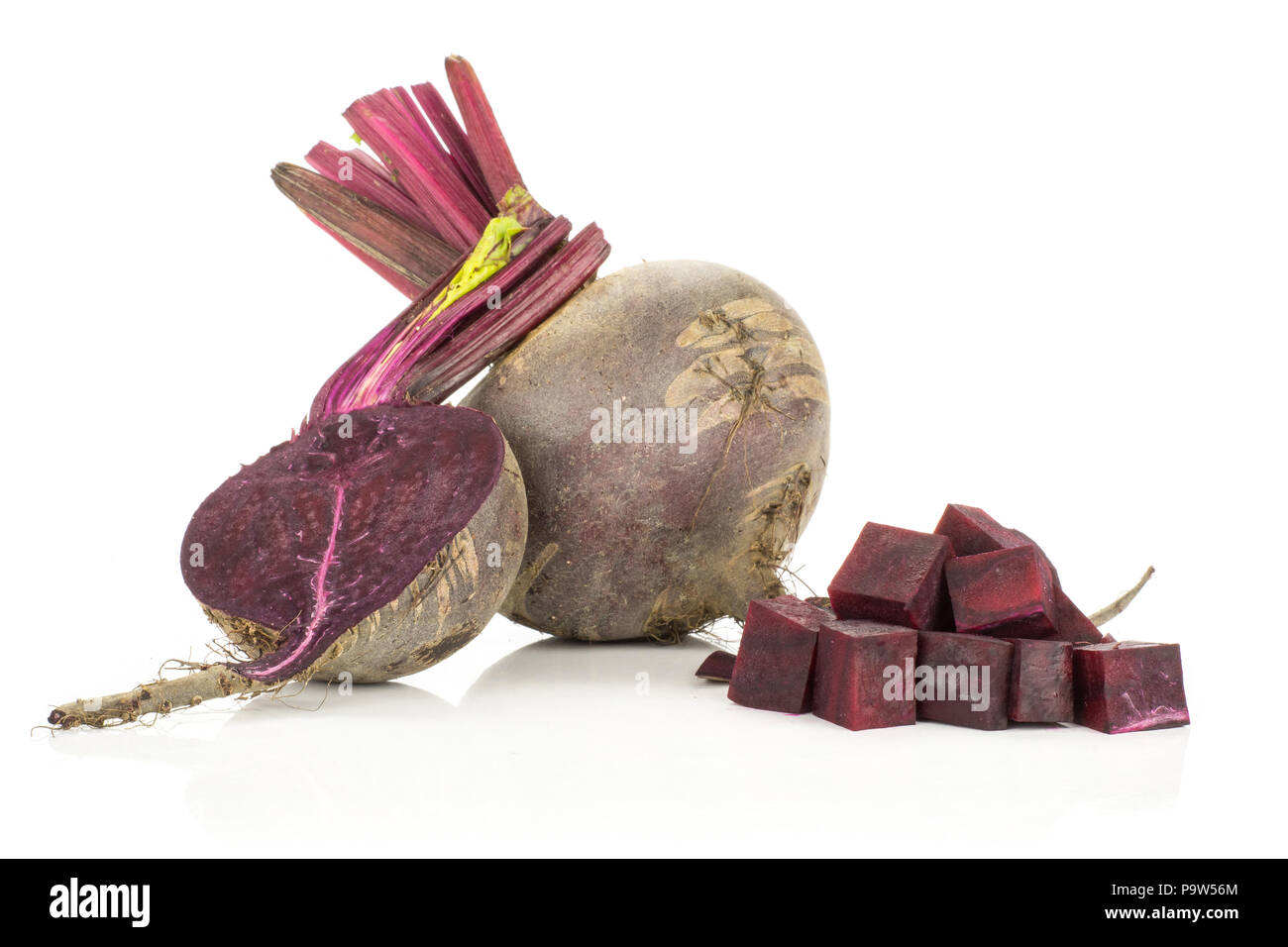 One red beet with section half and sliced squared pieces young bulbs ...