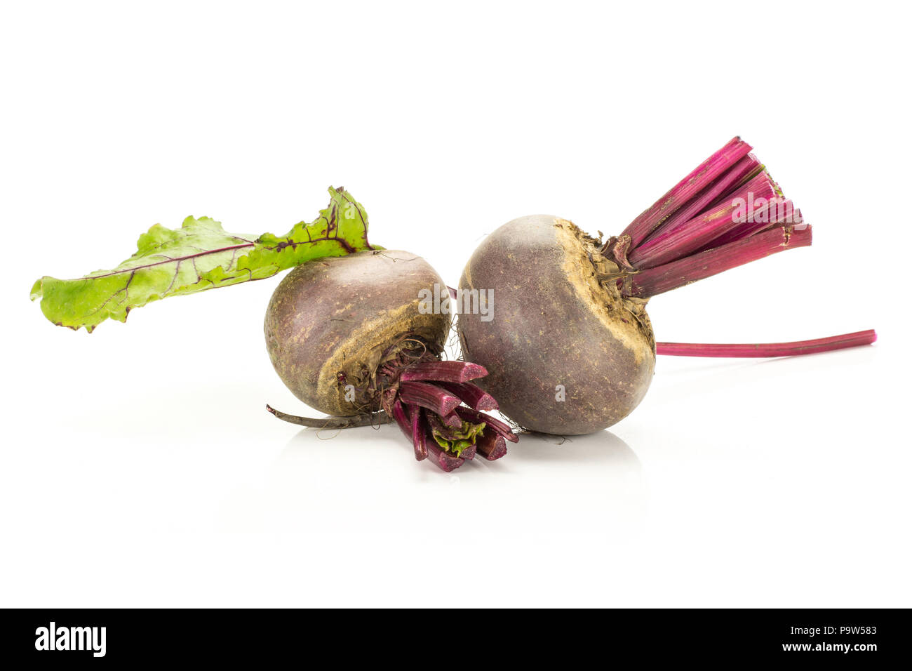 Red beet with cut tops two bulbs and green leaf isolated on white ...