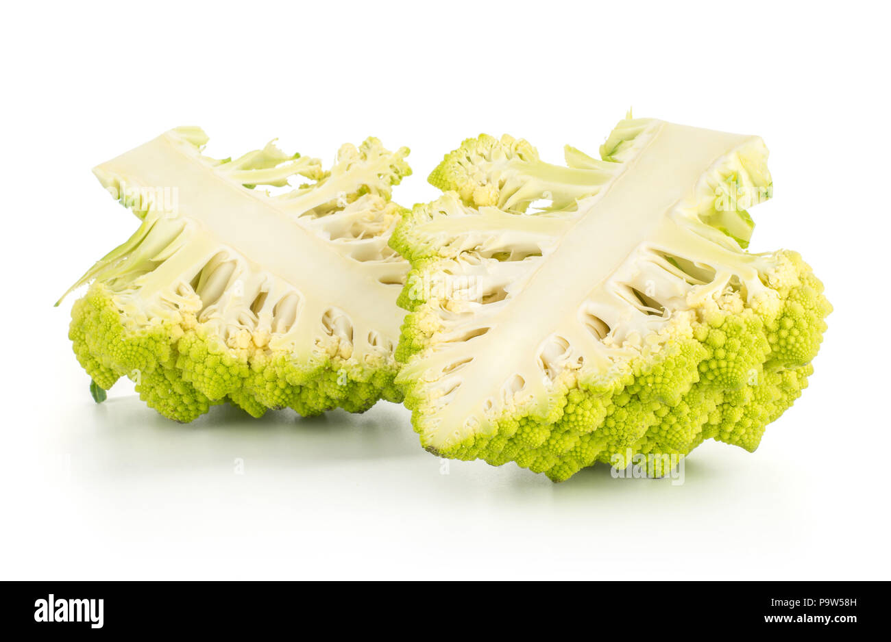 Two green Romanesco cauliflower halves isolated on white background ...