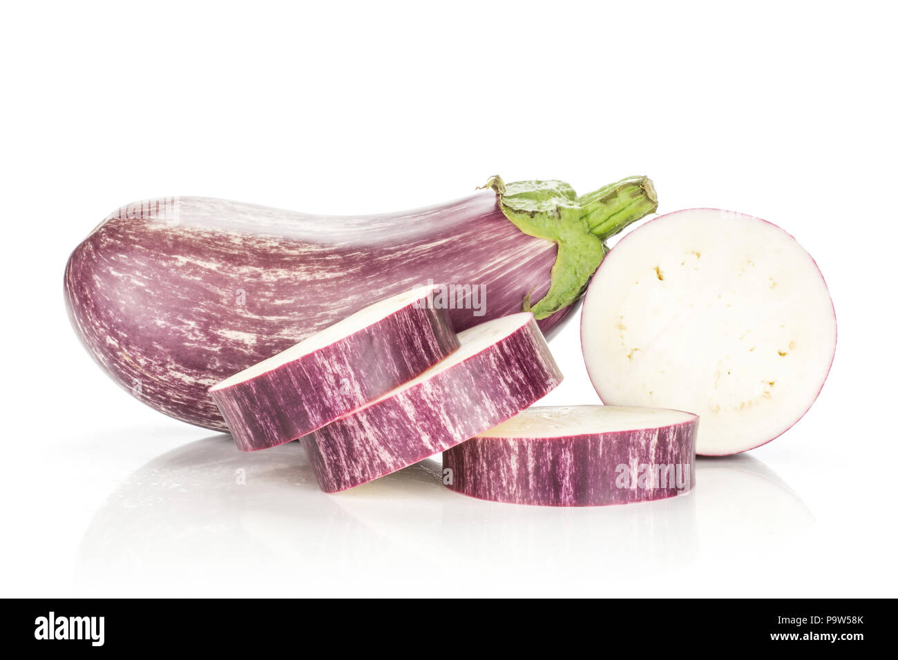 One striped purple eggplant with ring slices isolated on white ...