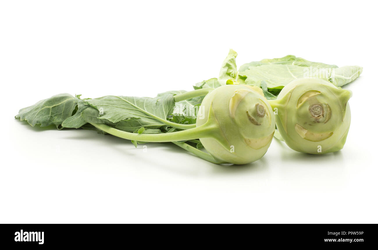 Two kohlrabi (German turnip or turnip cabbage) bulbs with fresh leaves ...