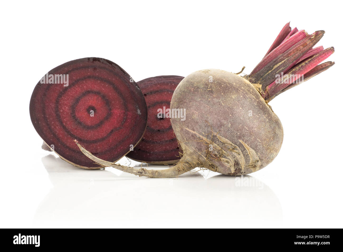 Sliced red beet one cut in two halves and whole bulb isolated on white ...