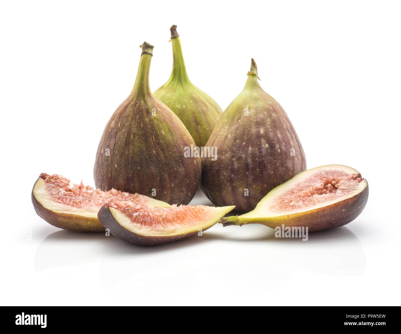 Three figs one half two slices isolated on white background ripe fresh ...