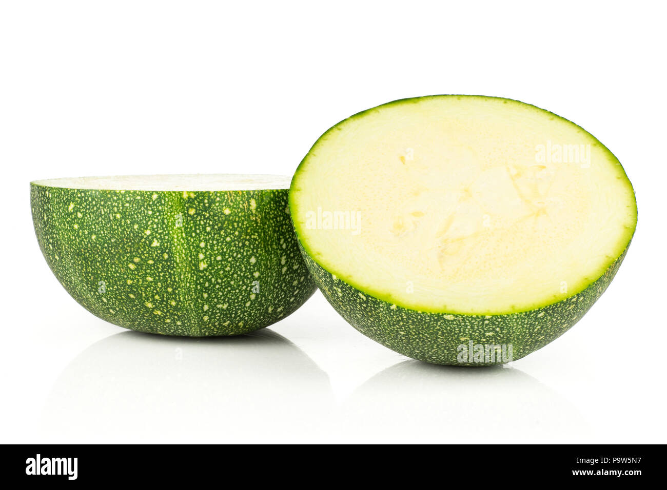 Two round zucchini halves isolated on white background fresh summer ...