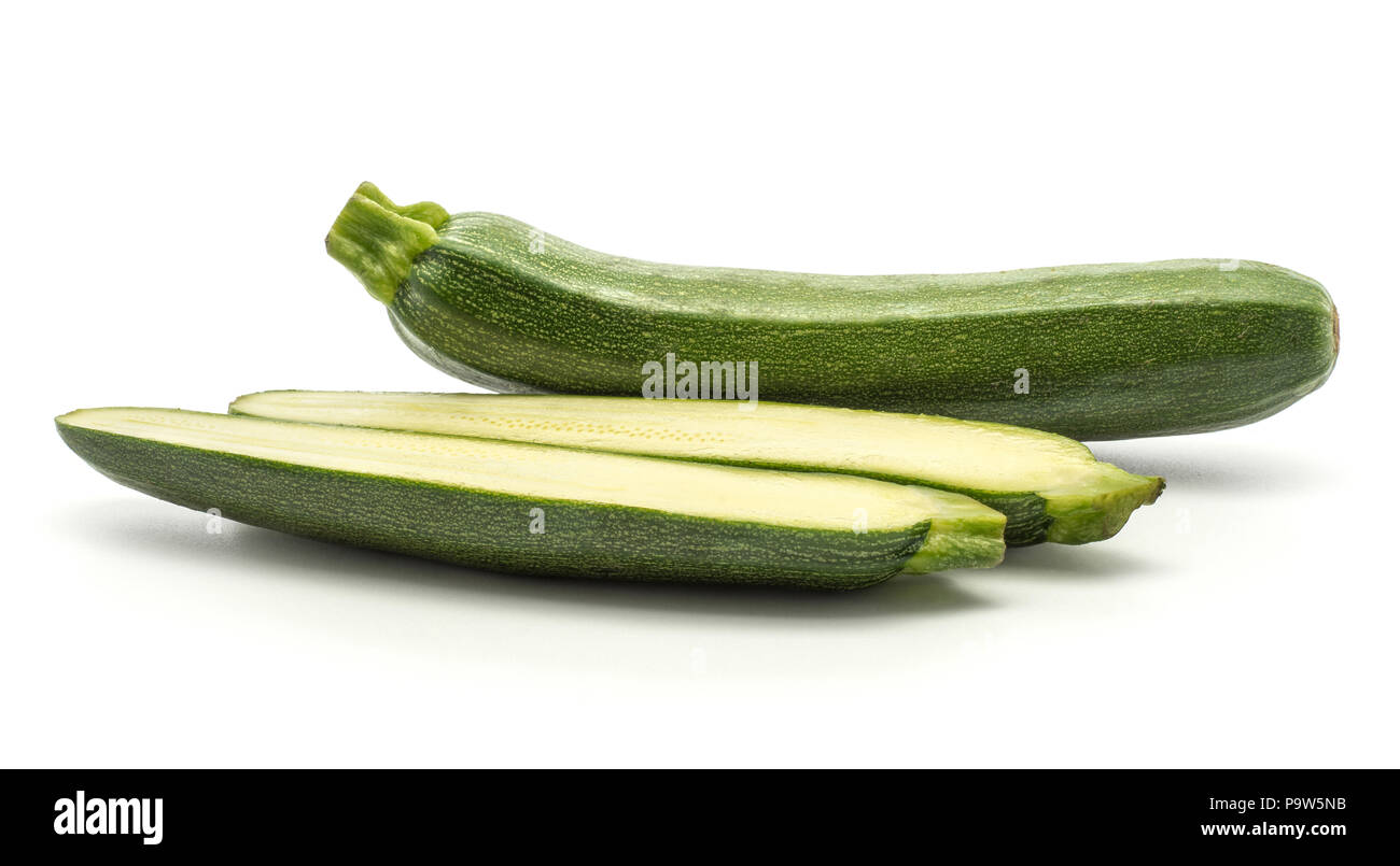 One green zucchini with two halves isolated on white background long ...