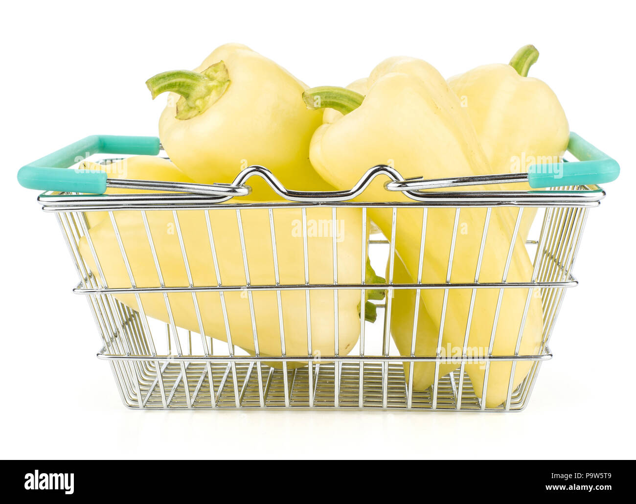 White paprika (Hungarian sweet peppers) in a shopping basket isolated ...