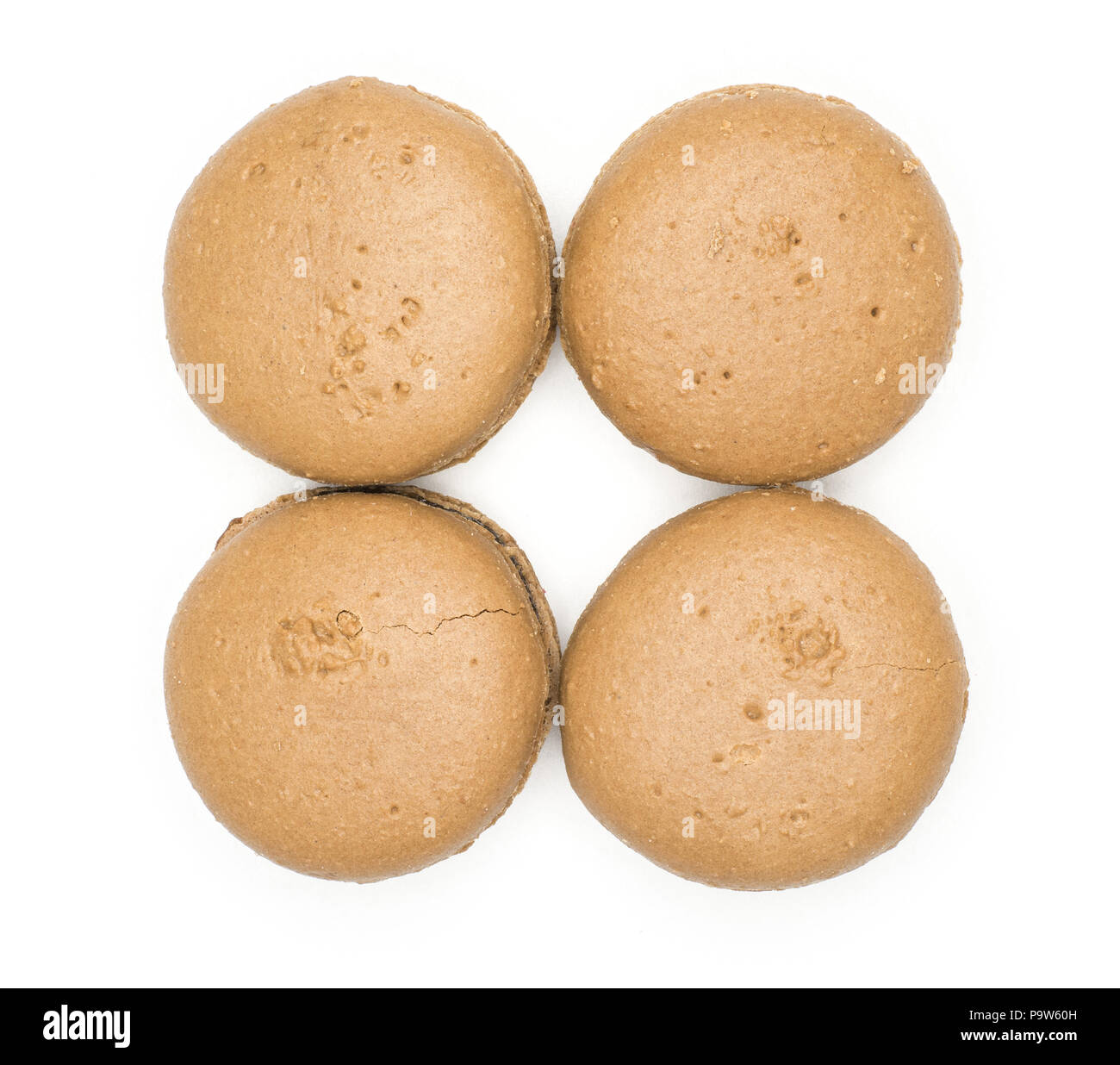 Chocolate French macarons top view isolated on white background four ...