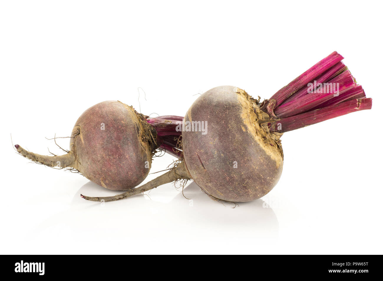 Red beet with cut tops two young bulbs isolated on white background ...