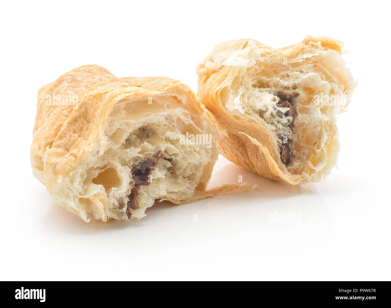 Two croissants or cornetto halves with chocolate cream isolated on ...