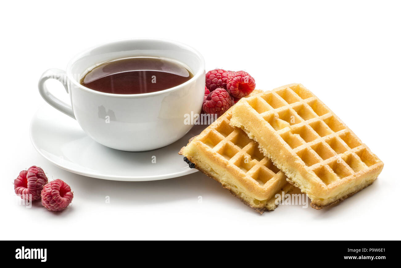 Traditional waffle (Belgian) with a cup of tea and fresh raspberries ...
