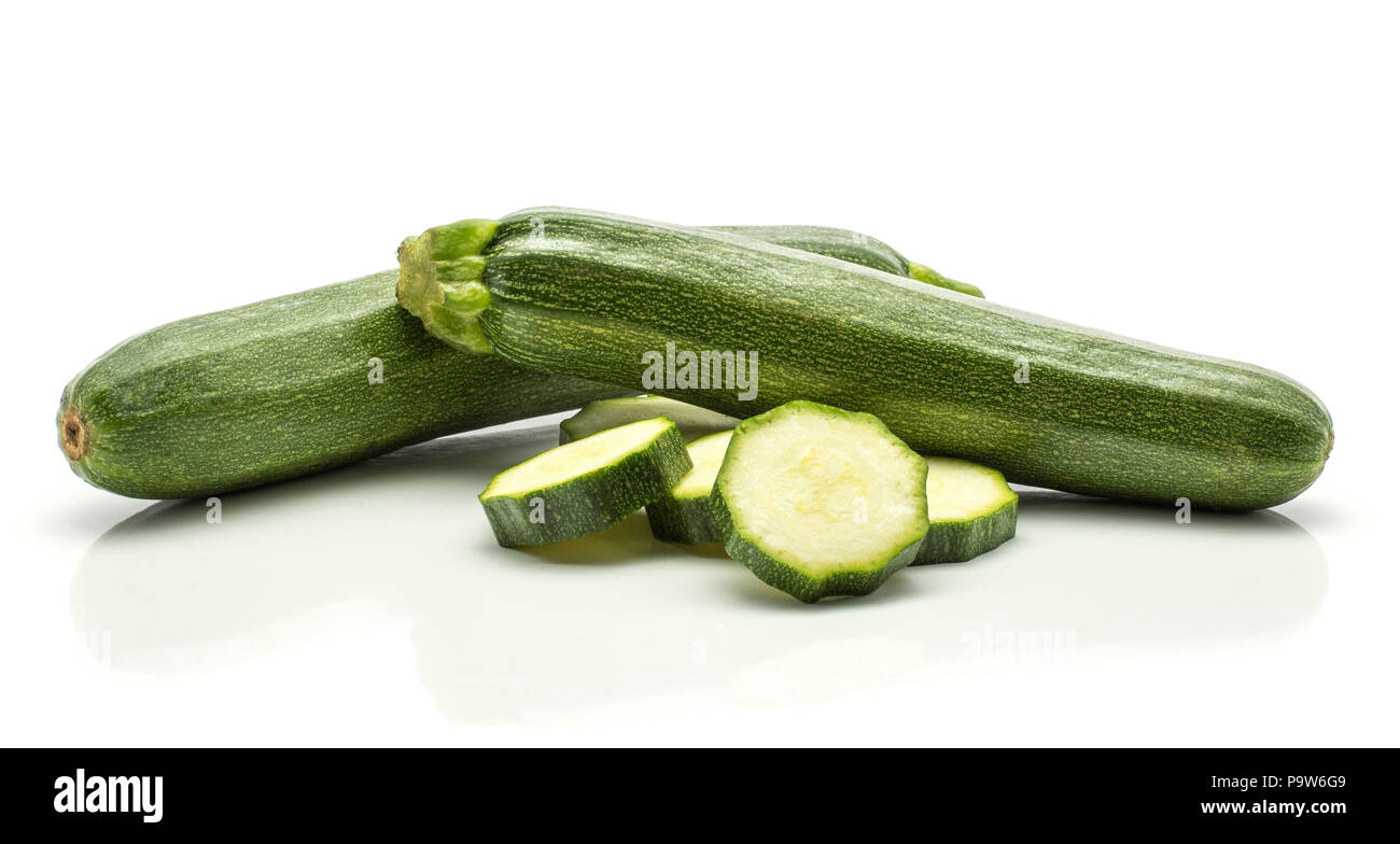 Two green zucchini and five slices stack raw courgette round pieces ...