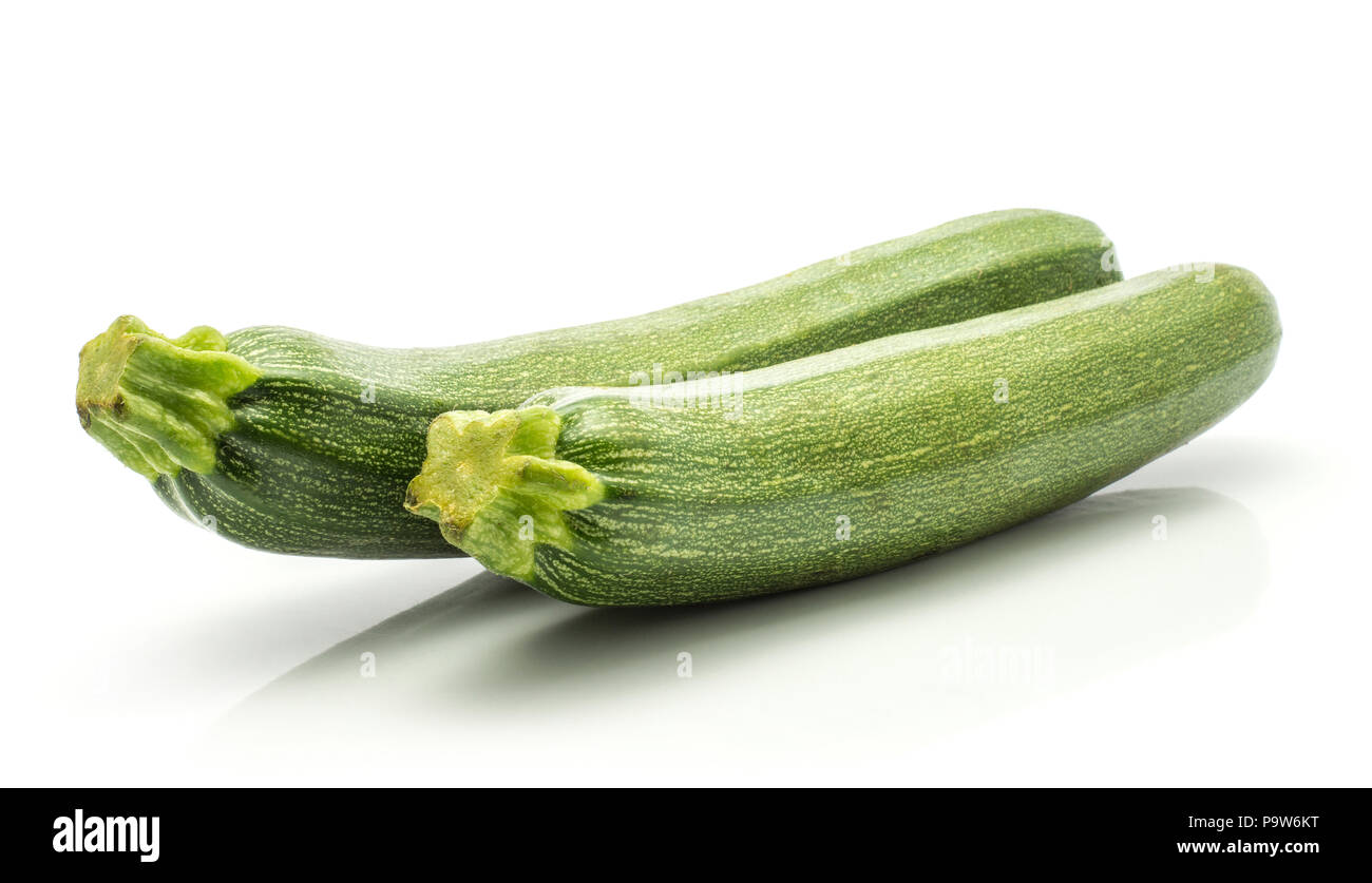 Green zucchini isolated on white background two long raw courgettes ...