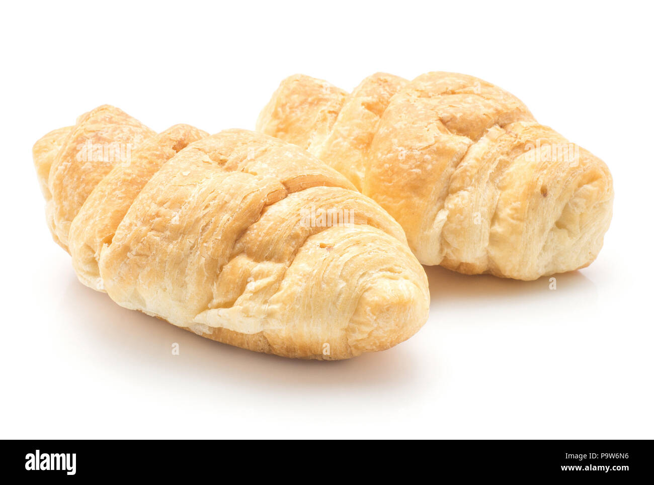 Two baked croissants or cornetto isolated on white background Stock ...