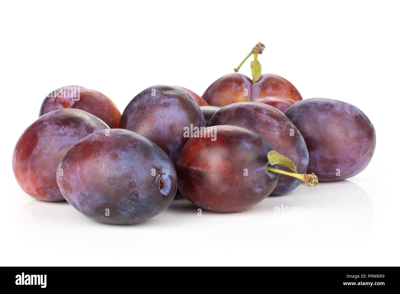 Lot of whole fresh violet-blue plum vibrant moyer variety isolated on ...