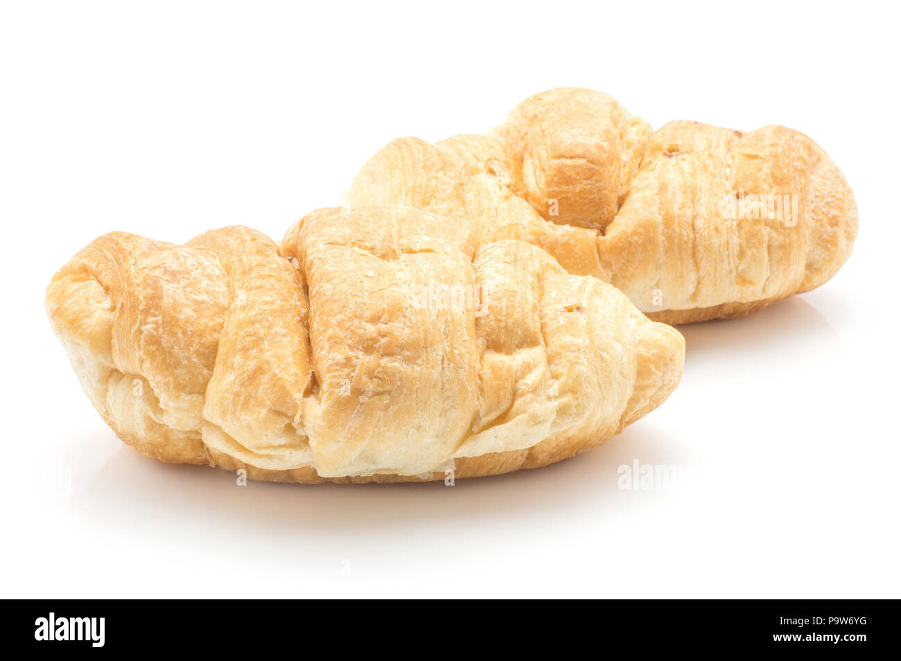 Fresh baked croissants or two cornetto isolated on white background ...