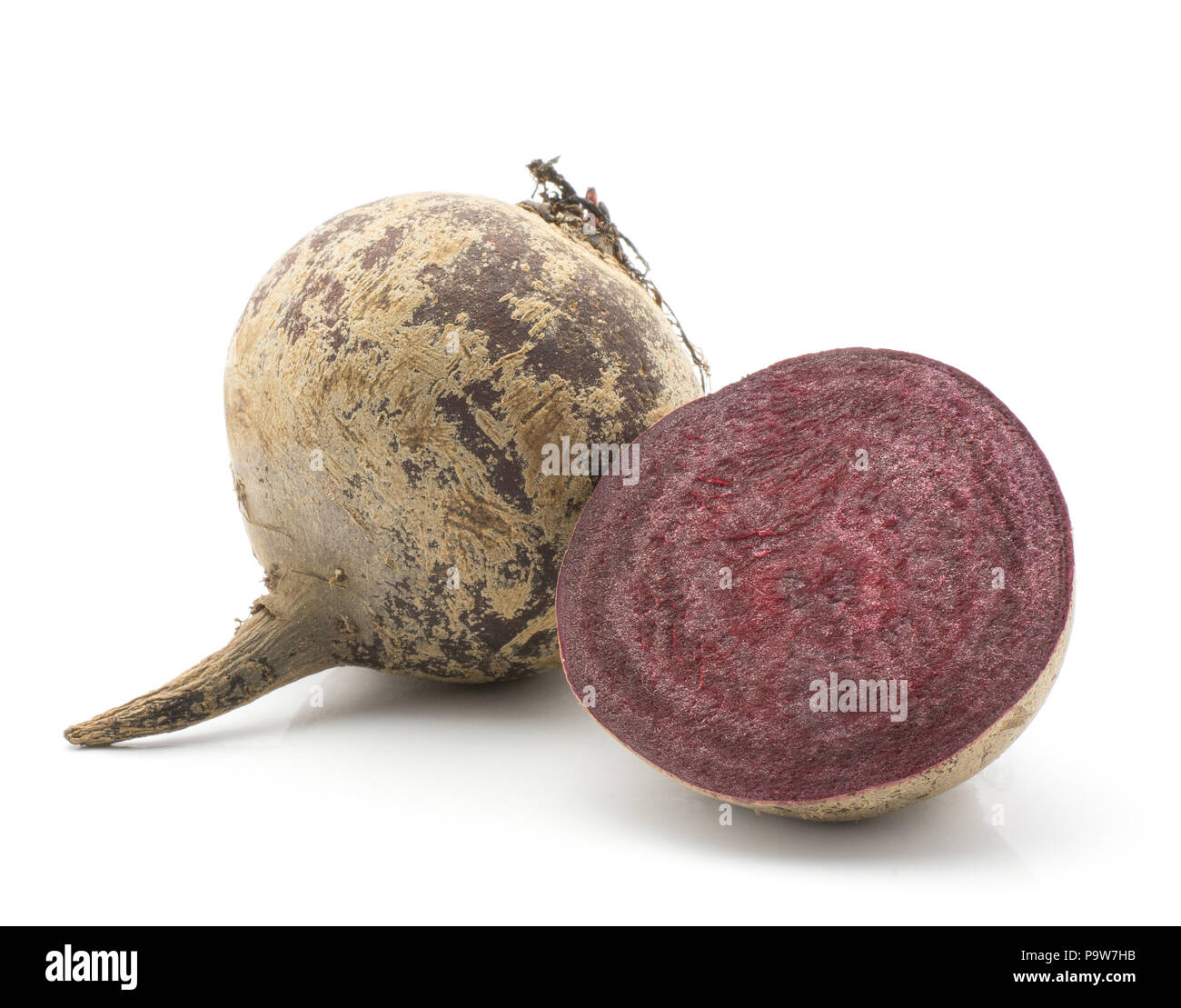 One beetroot bulb and a half (raw red beet) isolated on white ...