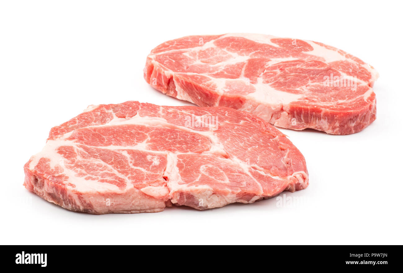 Two raw pork neck meat cuts isolated on white background fresh slices ...