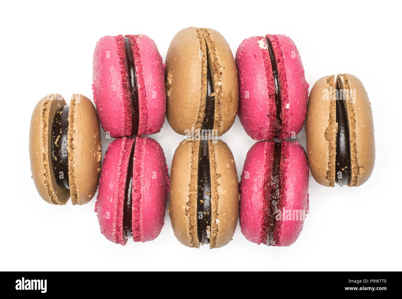 French macarons (chocolate and raspberry) top view isolated on white ...