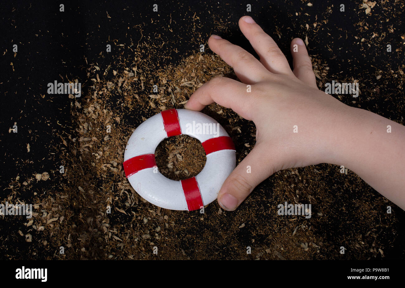 Little model life preserver is being held in hand Stock Photo - Alamy