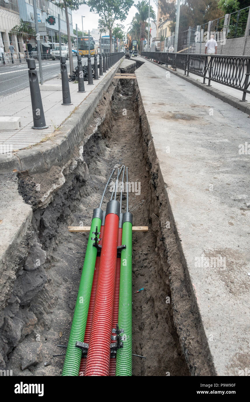 Installing 66 kilowatt sunterranean electricity cables in street in ...