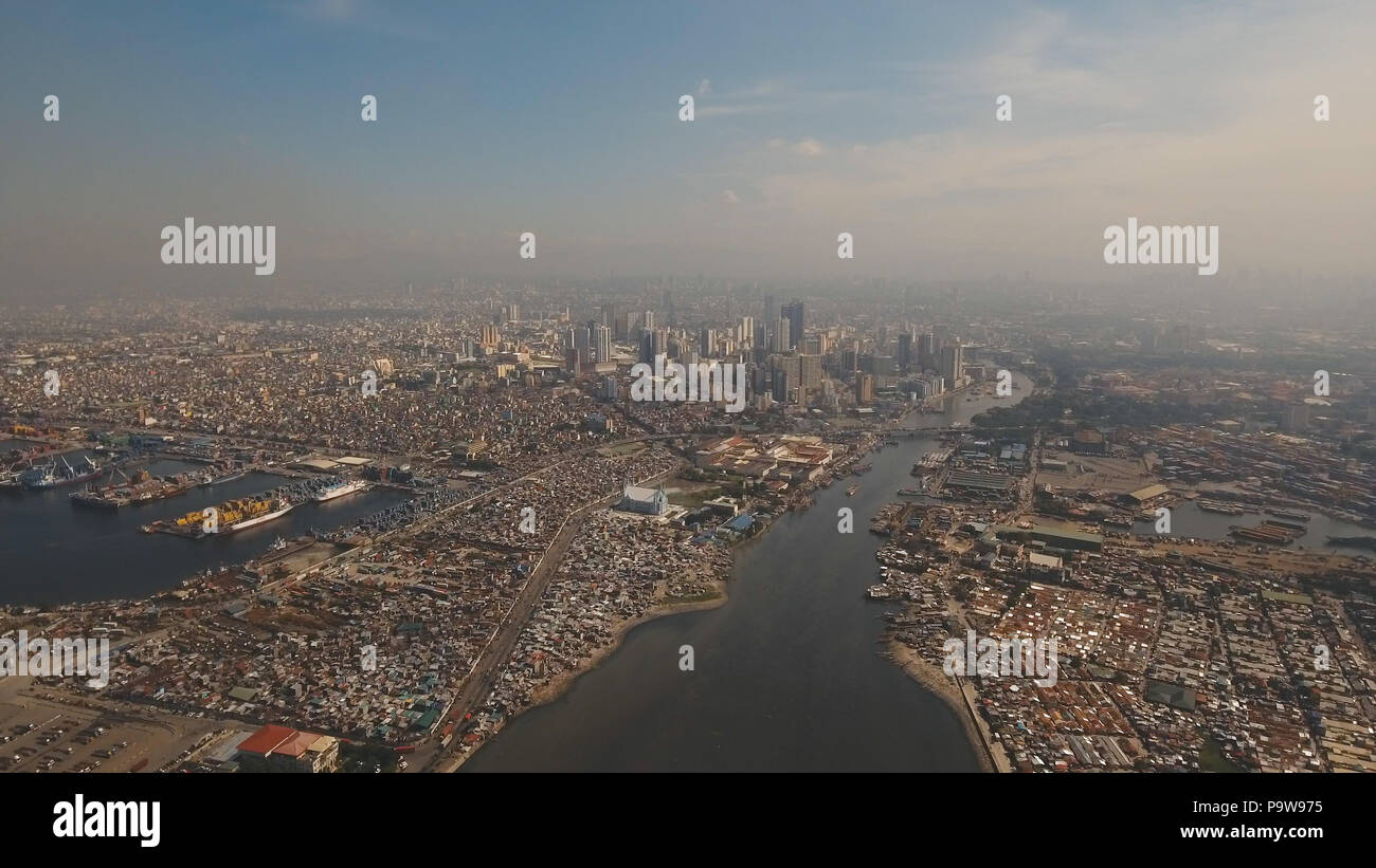 Aerial view skyline of Manila city. Fly over city with skyscrapers and ...