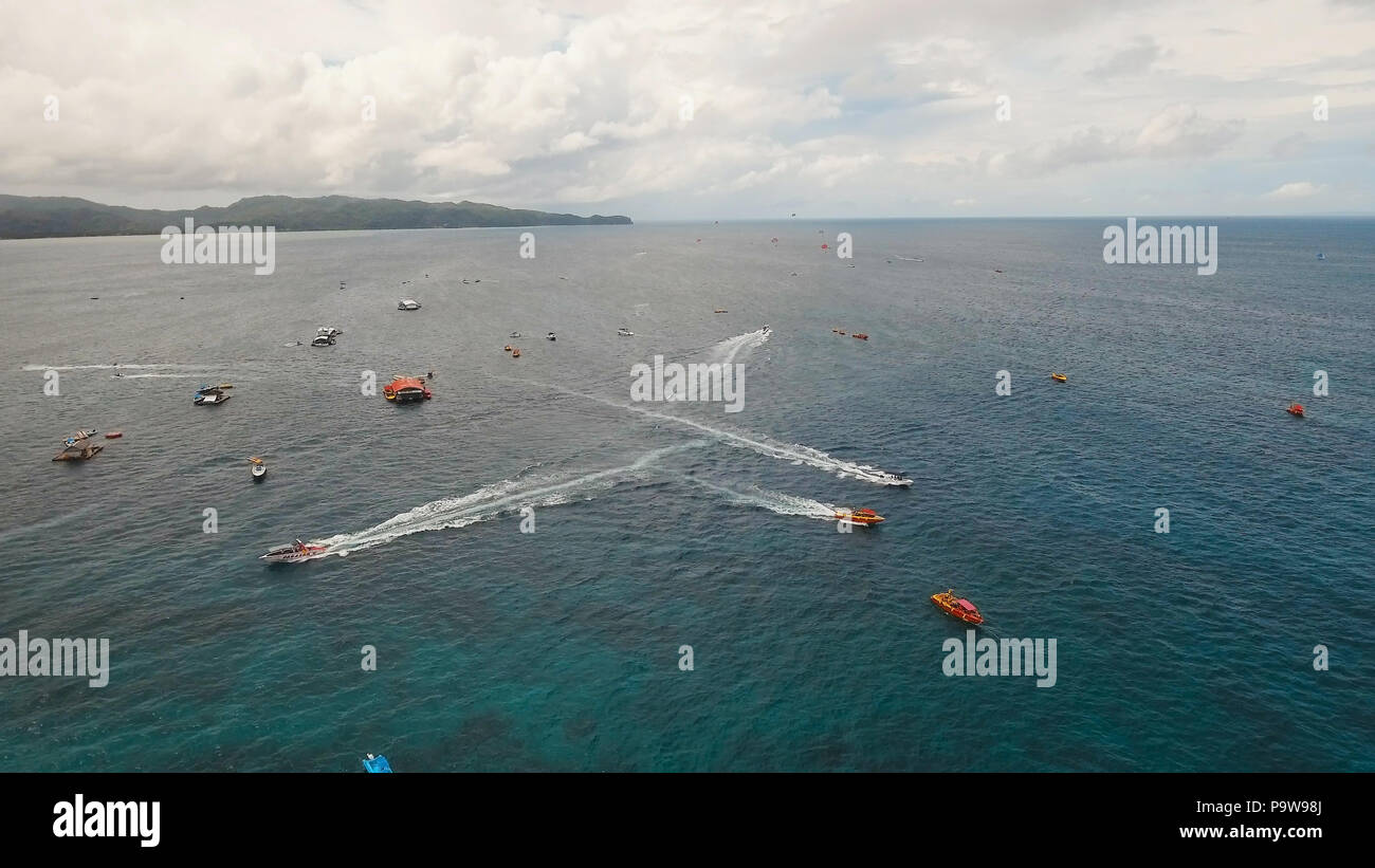 Summer sport, parasailing and boat, Boracay. Water sports and ...