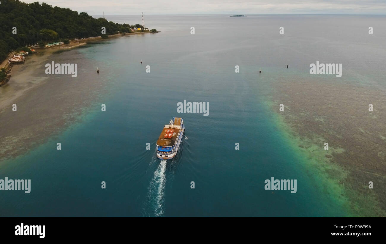 Aerial view passenger ferry floats in the blue sea.Asian passenger boat ...