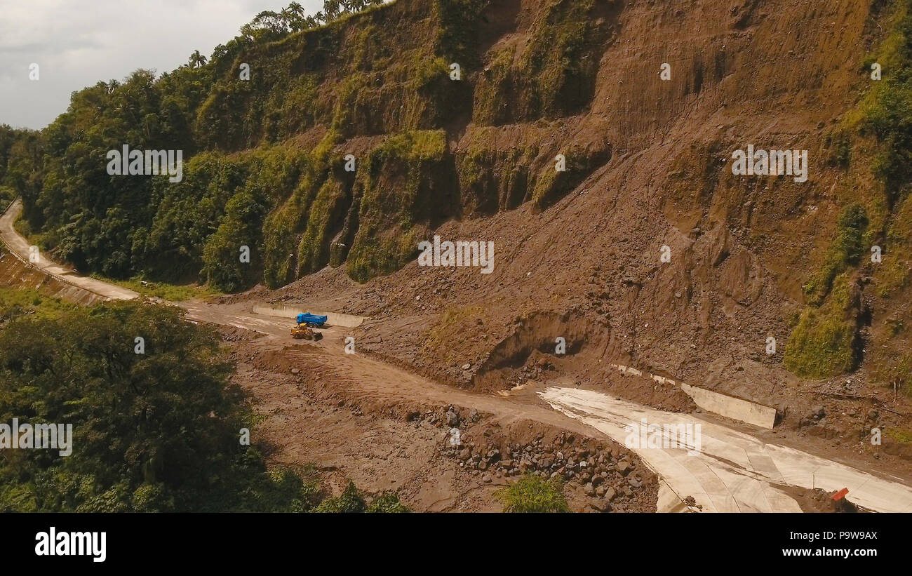Landslides and rockfalls on the road in the mountains, Camiguin. Aerial ...