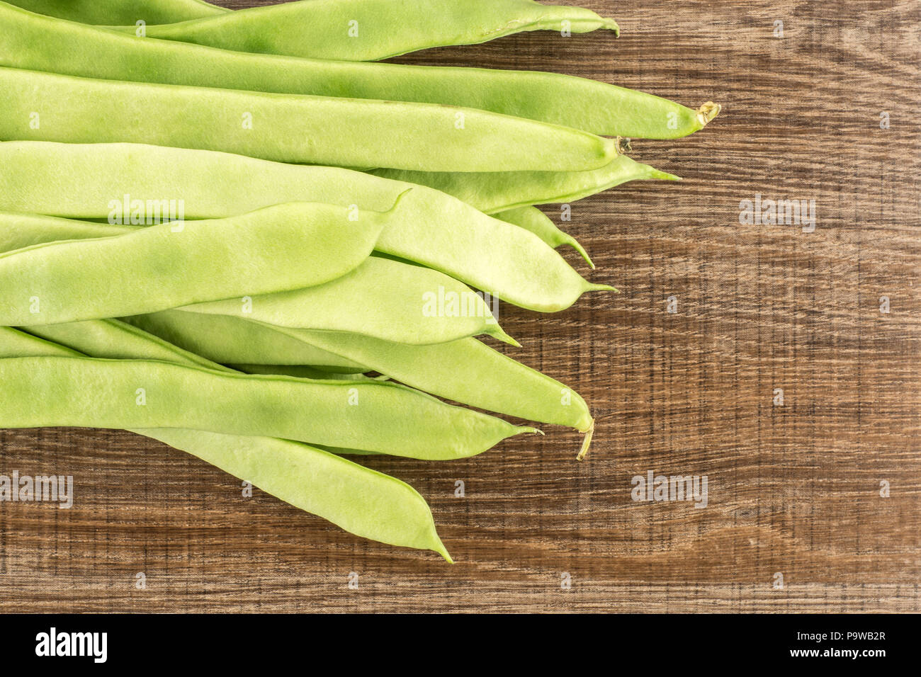 Flat green beans top view isolated on wooden background long Stock ...