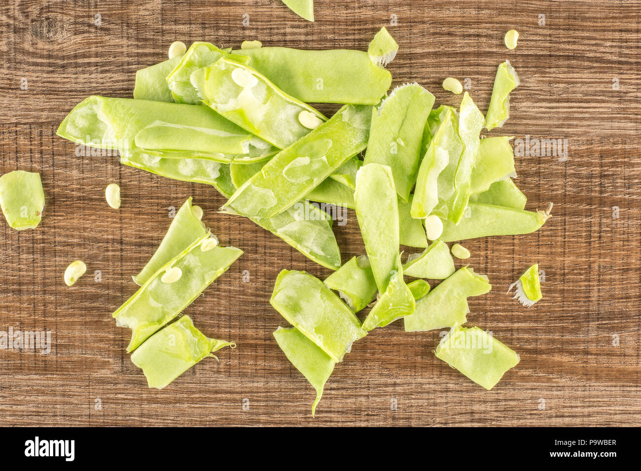 Flat green beans stack with seeds top view isolated on wooden ...