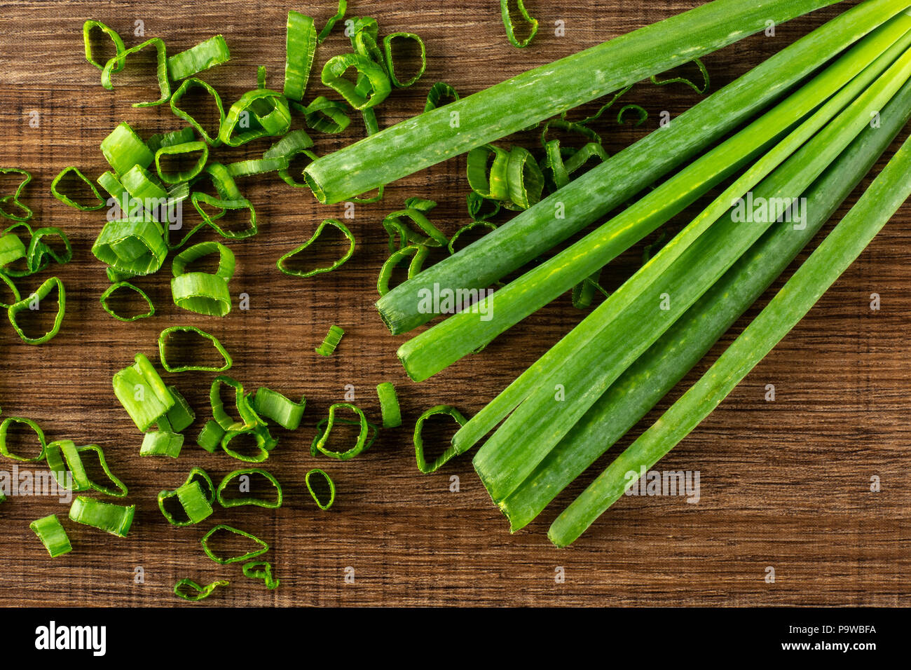 Fresh green spring onion red scallion variety long leaves with chopped ...