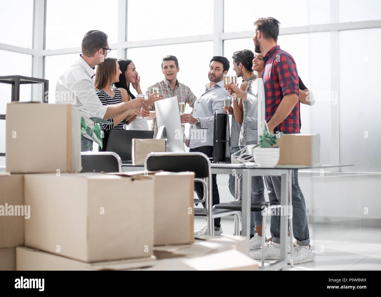 business team celebrates the move while standing in the office Stock ...