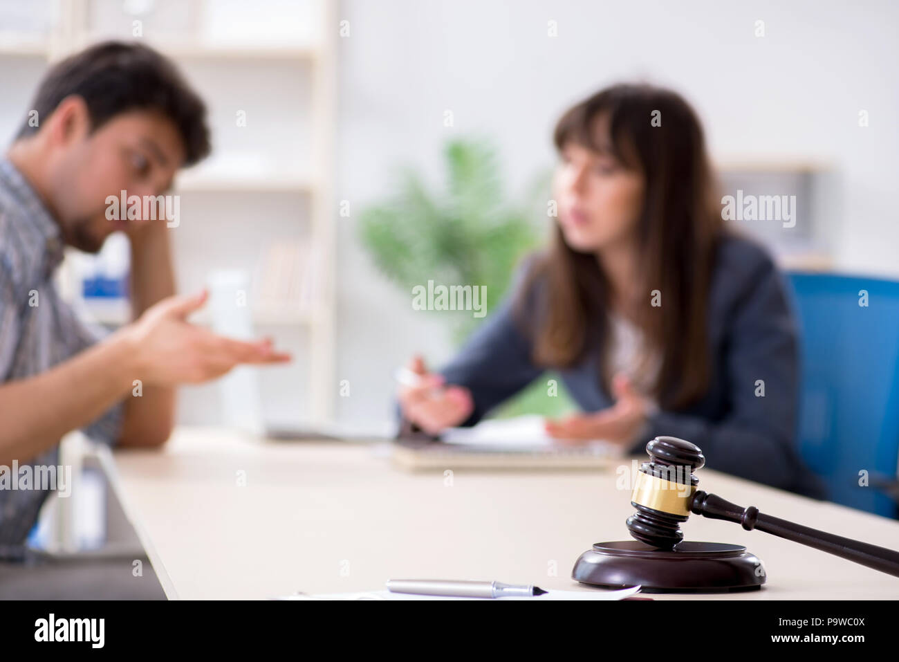 Female lawyer meeting with his male client in the office Stock Photo ...