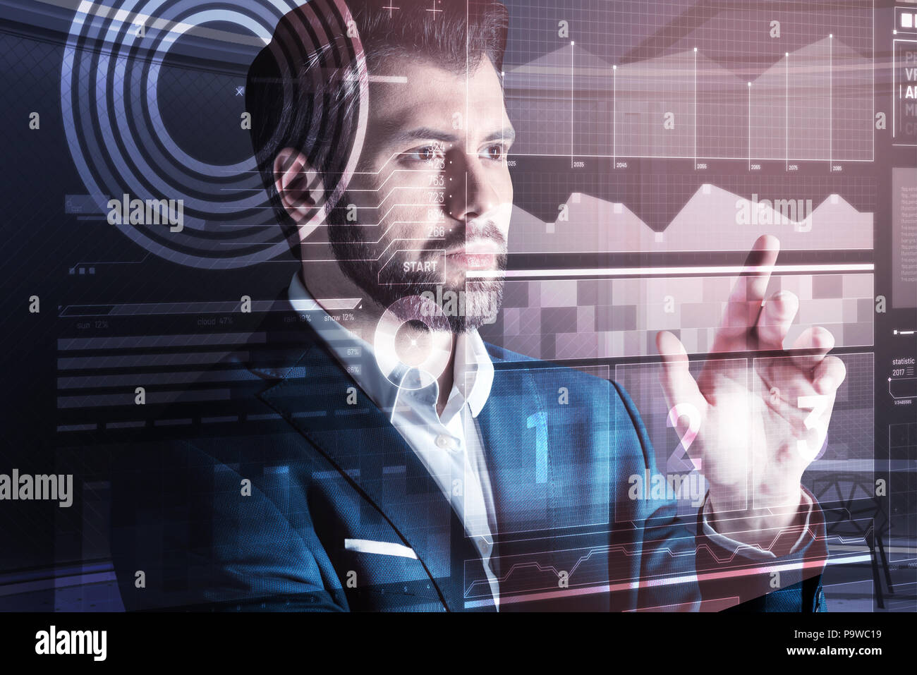 Feeling interested. Calm attentive web developer standing in front of a ...