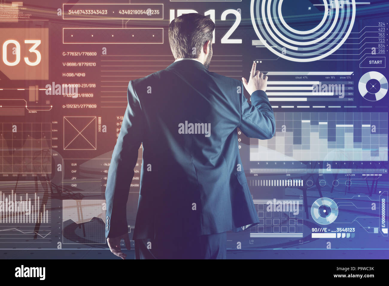 Futuristic work. Professional web developer wearing a suit and looking calm while working with a ...