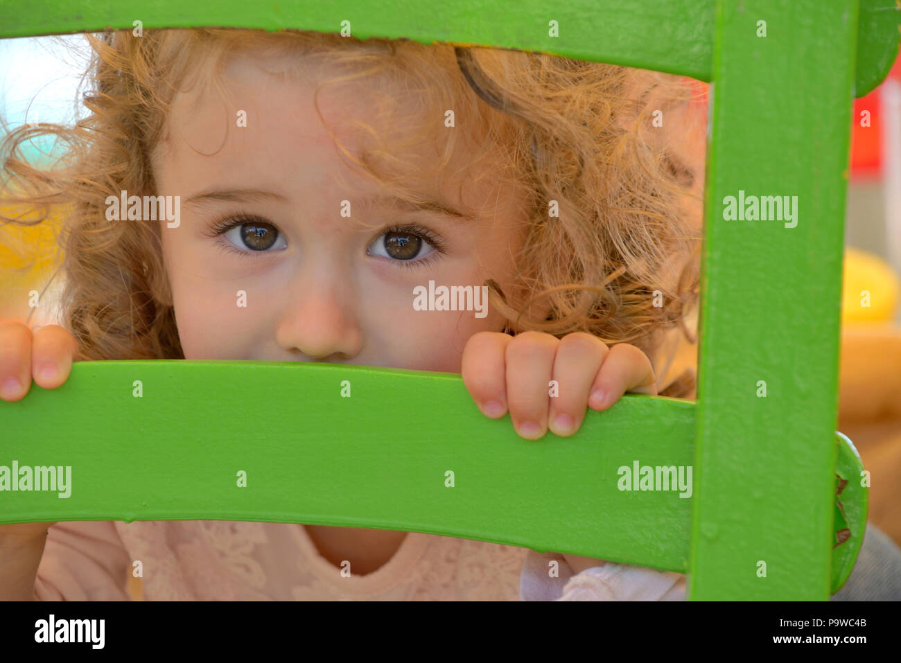 Child Behind Chair High Resolution Stock Photography and Images - Alamy