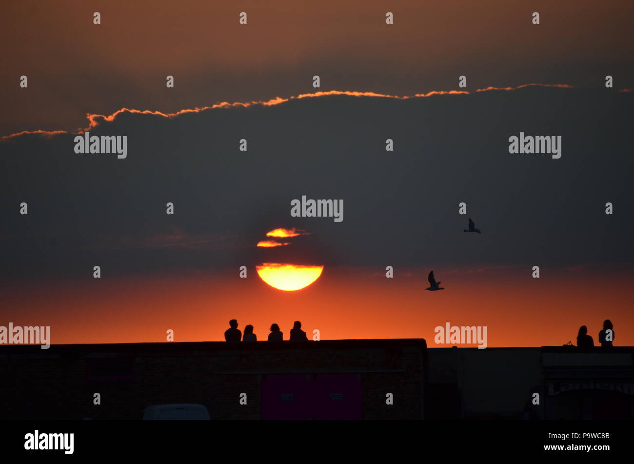 Watching sunset uk hi-res stock photography and images - Alamy