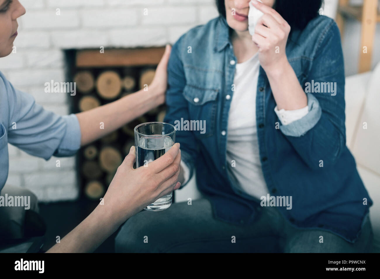 Drink it. Selective focus of a glass being filled with water while ...