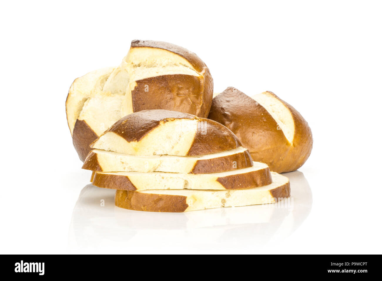 Two Bavarian bread buns and four sliced pieces isolated on white ...
