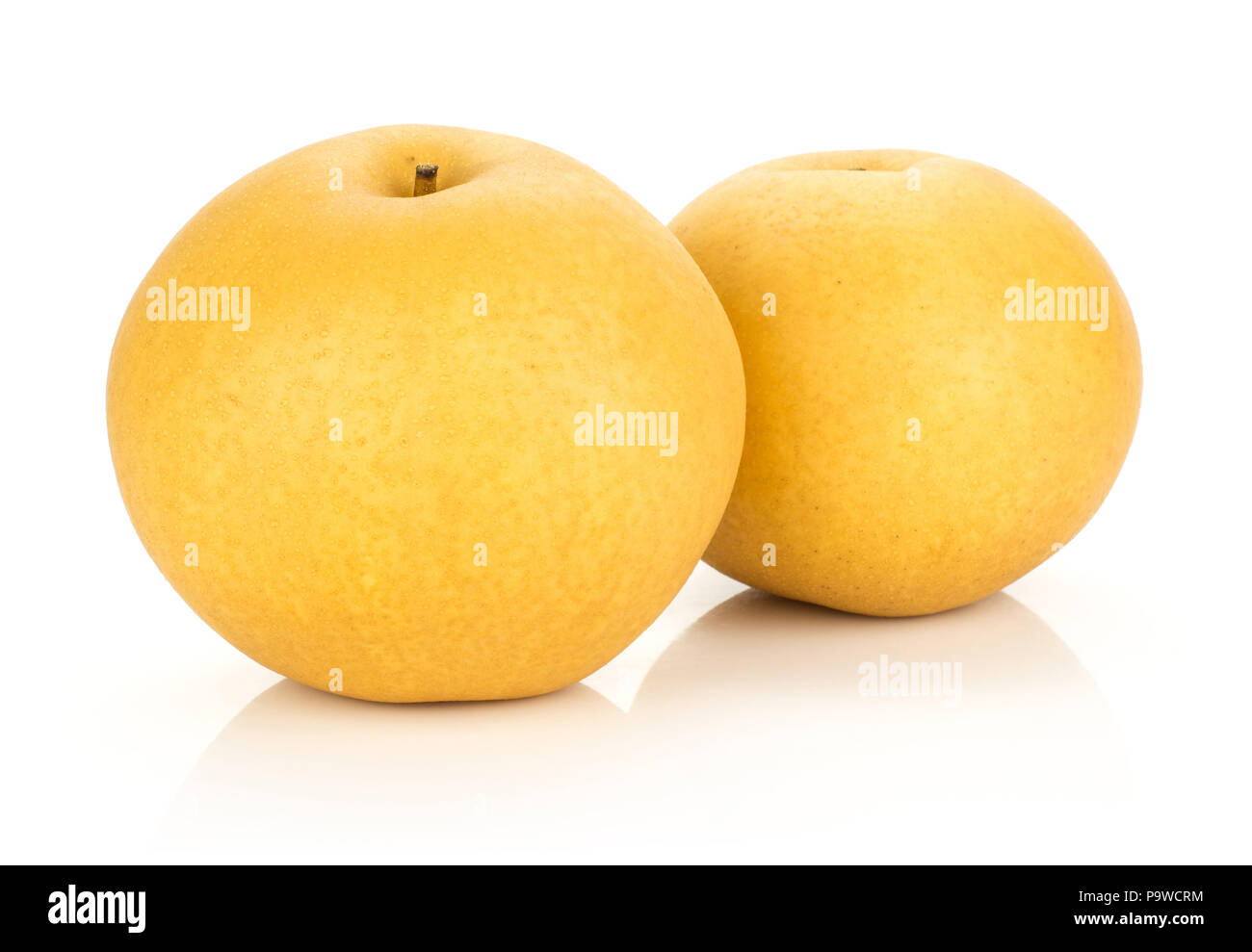 Chinese golden pears Nashi variety isolated on white background two ...