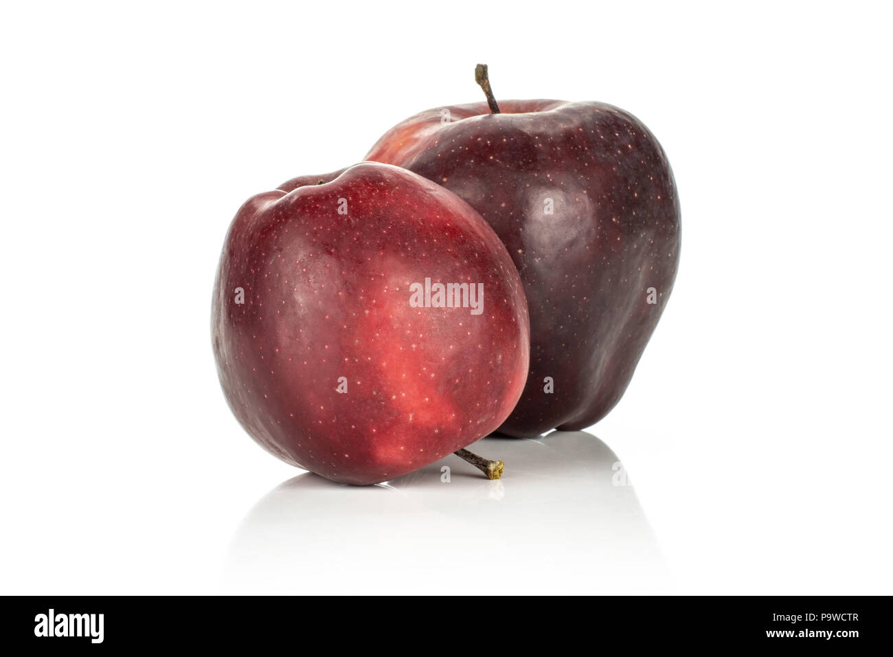 Two red delicious apples isolated on white background light and deep ...