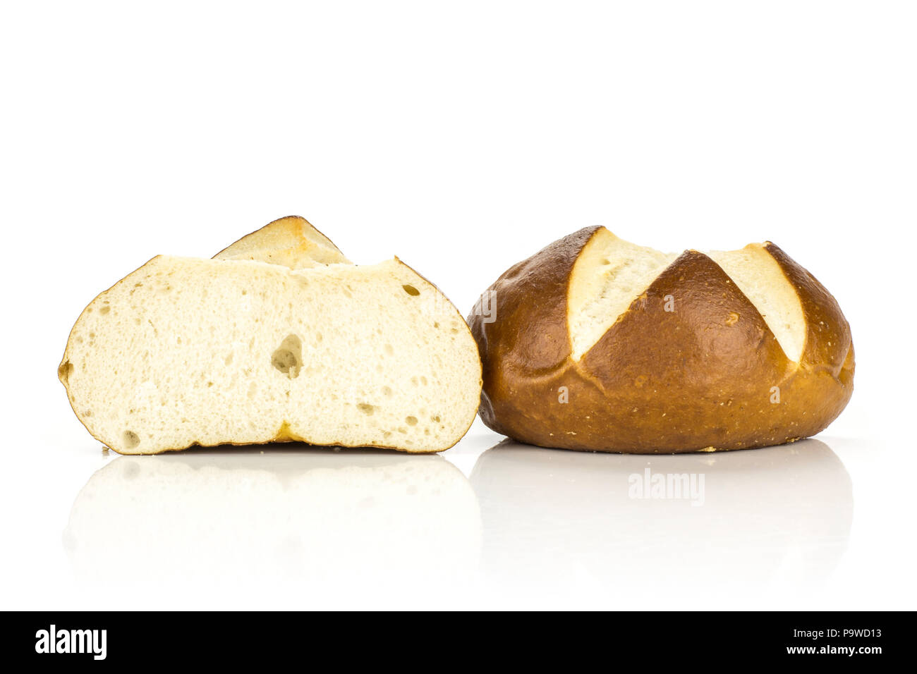 One Bavarian bread bun and secton half isolated on white background ...