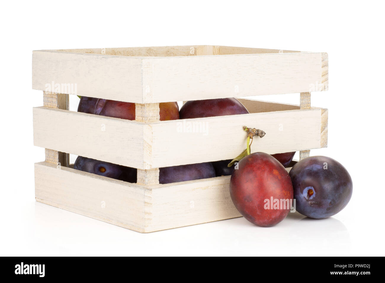 Lot of whole fresh violet-blue plum vibrant moyer variety in a wooden ...